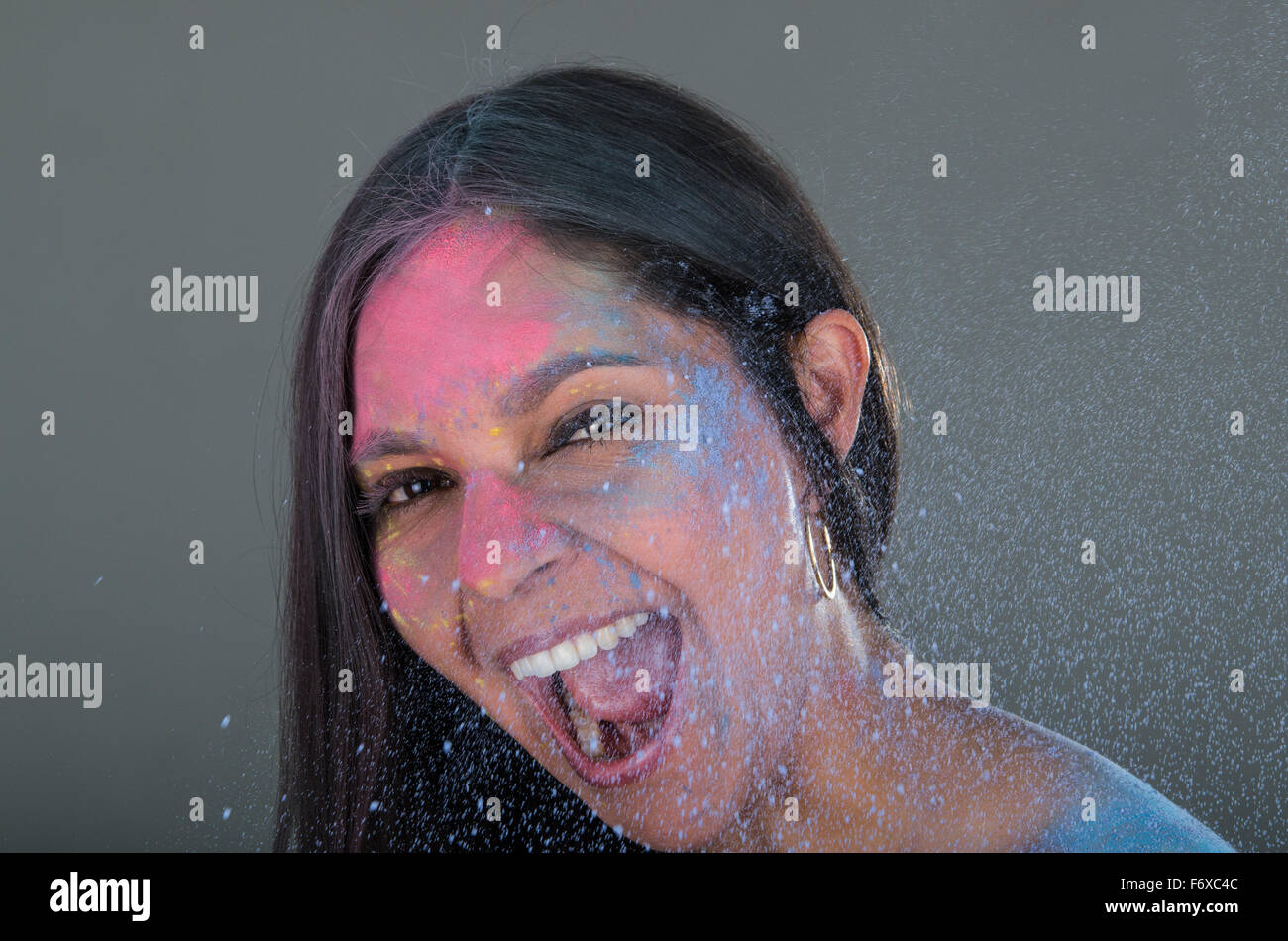 Beautiful young brunette girl with colorful decorated face Stock Photo ...