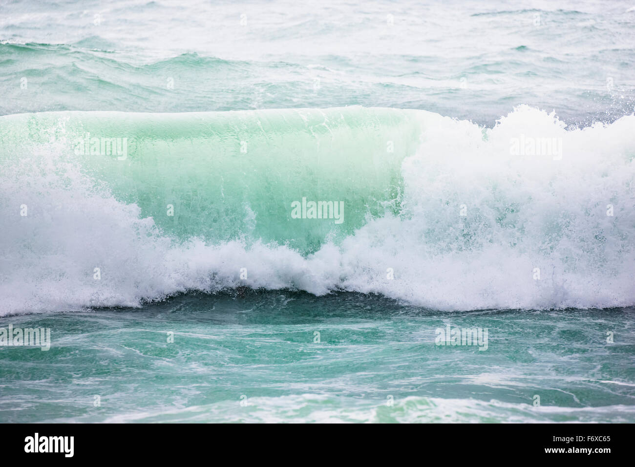 Wave breaking on the shore of St. Paul Island, Bering Sea, Southwestern ...