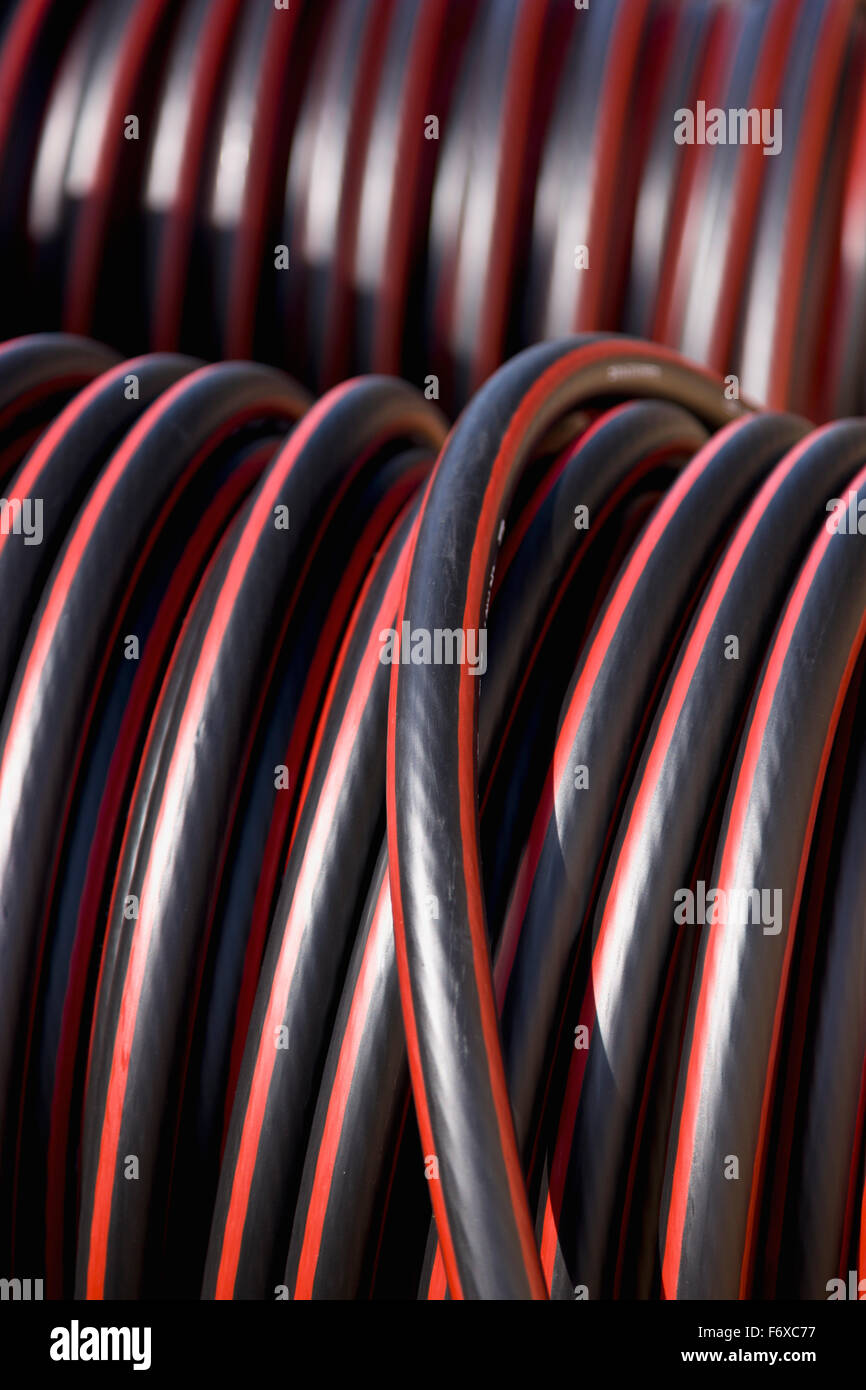 Detail of large diameter cable coiled on wooden spools at an electrical ...
