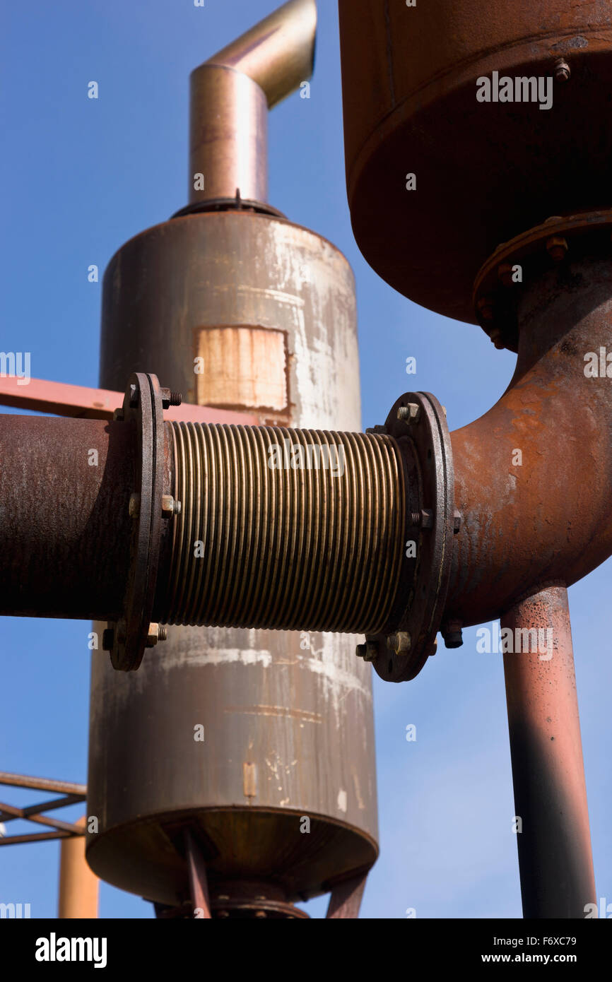 Threaded pipe fittings connecting rusty pipe outside an electrical ...