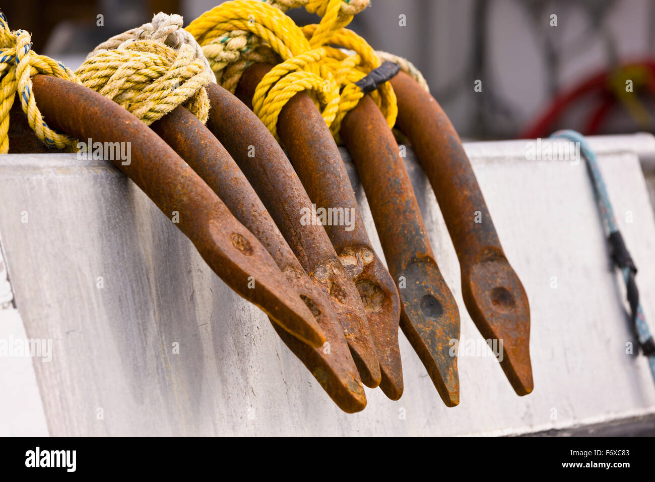 Close up of rusted iron hooks on the edge of a fishing boat, Sand Point ...