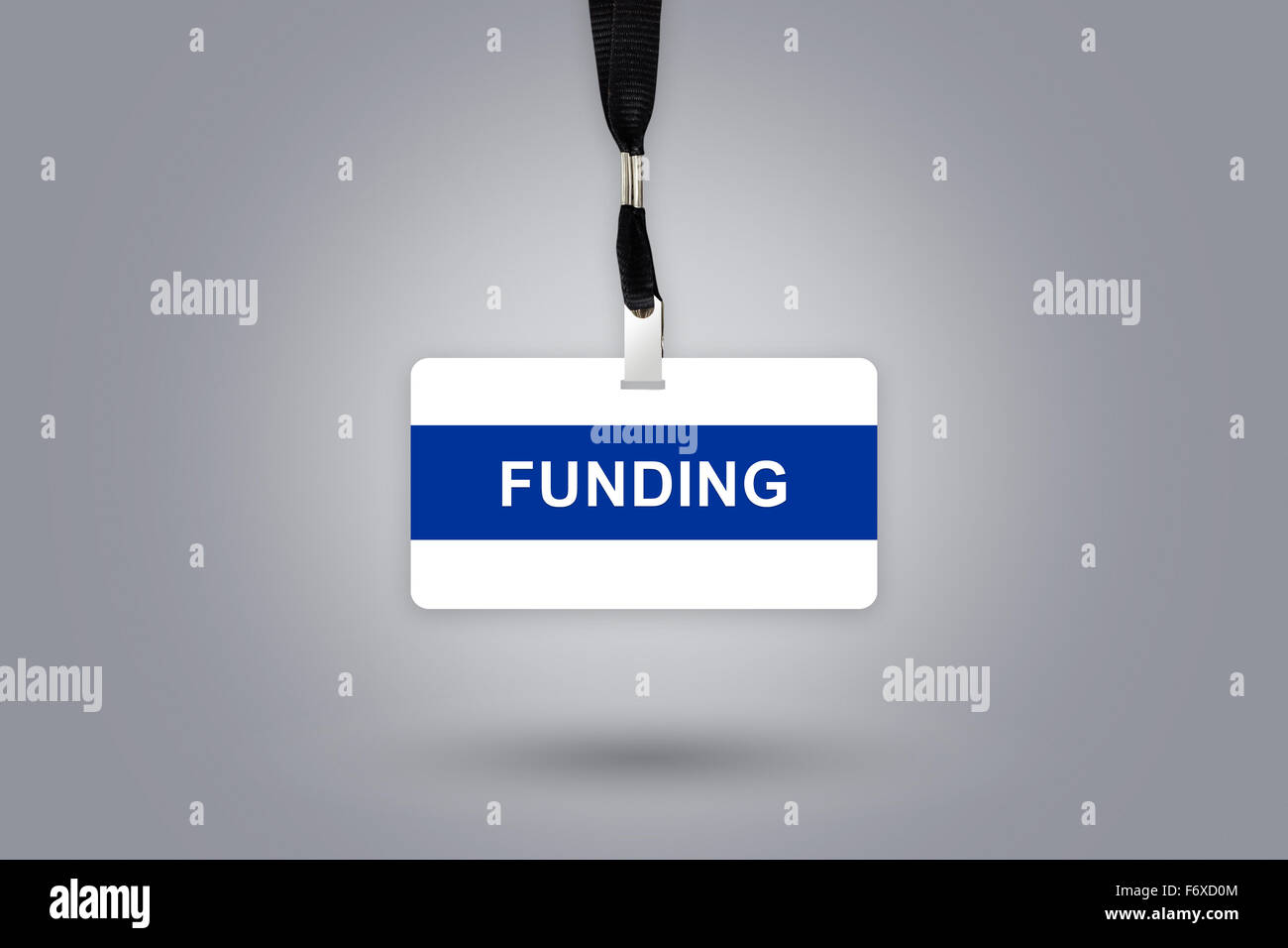 funding on badge with grey radial gradient background Stock Photo - Alamy