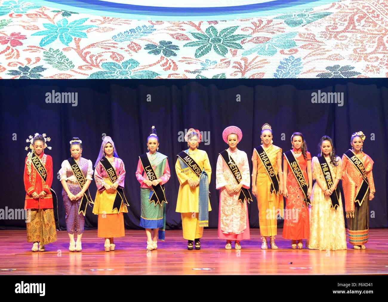 Kuala Lumpur. 21st Nov, 2015. Women in traditional attire attend the ...