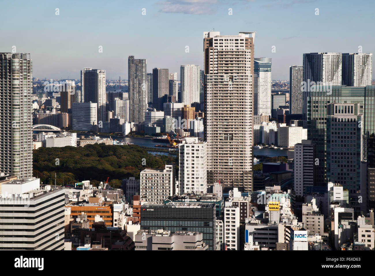 Skyscrapers in a dense city with blue sky; Tokyo, Japan Stock Photo - Alamy