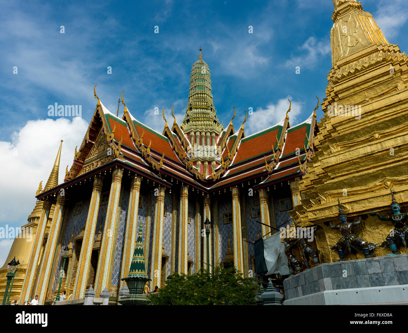 Ornate building and gold structures with statues, Temple of the Emerald ...