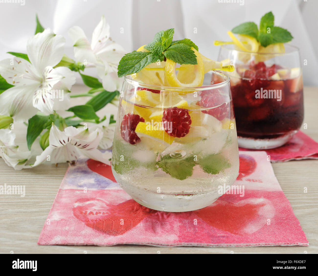 A glass of fresh homemade lemonade with mint and raspberries Stock ...