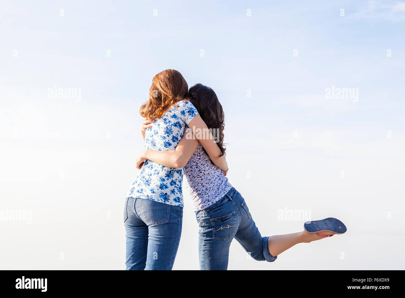 Two girls with their arms around each other; Toronto, Ontario, Canada ...
