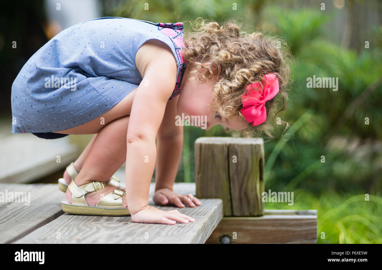 Stooping girl hi-res stock photography and images - Alamy