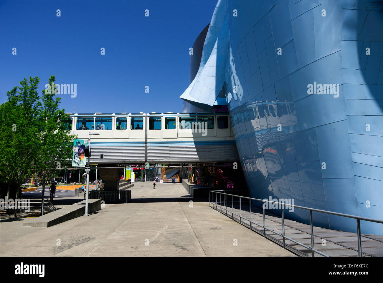 Seattle Center Monorail Skytrain comes out of EMP Museum heading for ...