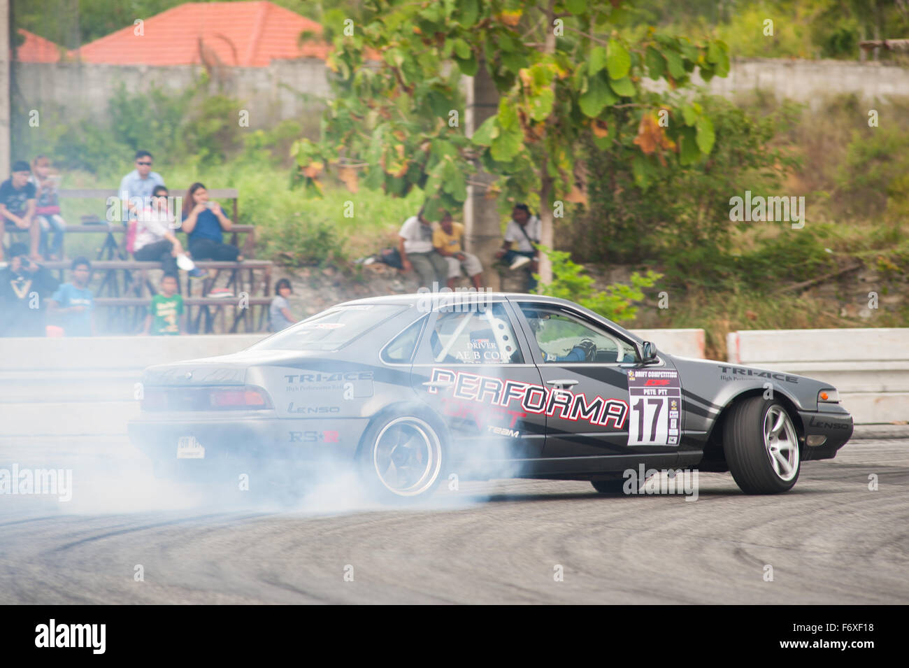 A Nissan Cefiro participating at a drifting competition in Chayapruek ...