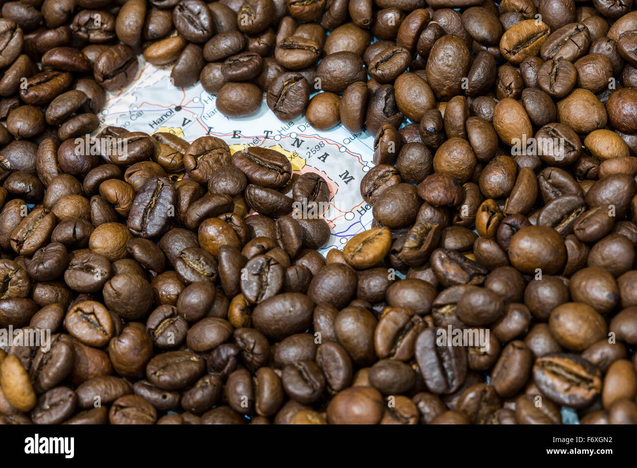 Geographical map of Vietnam covered by a background of roasted coffee ...