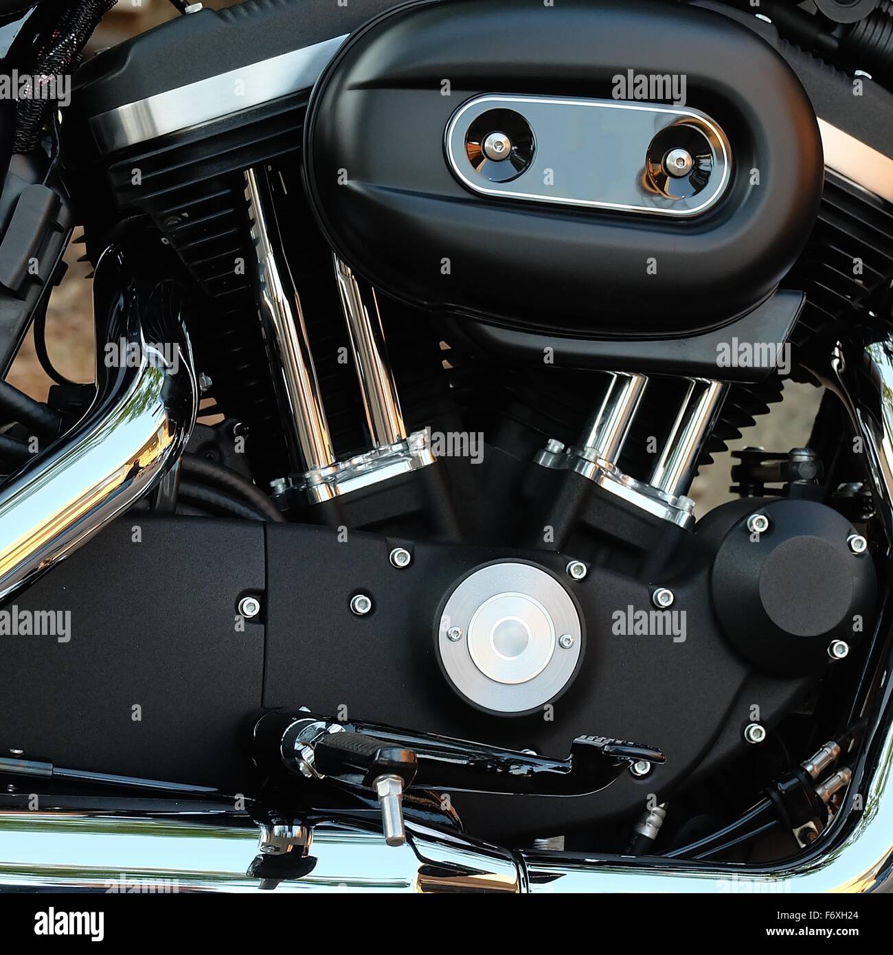 Chrome and matt black engine, gearbox and exhaust of a large, powerful ...