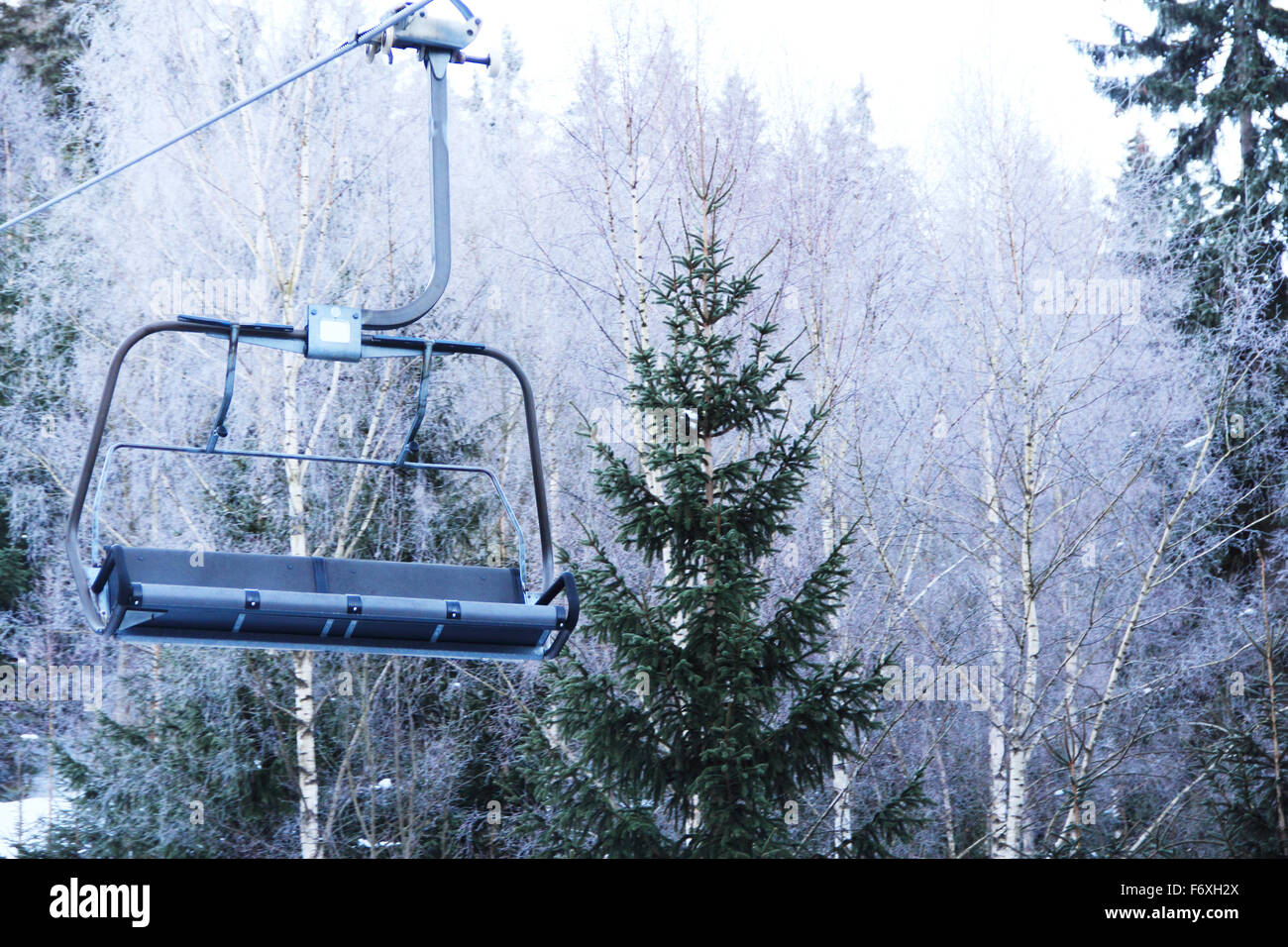 Ski lift on winter forest background close-up Stock Photo - Alamy