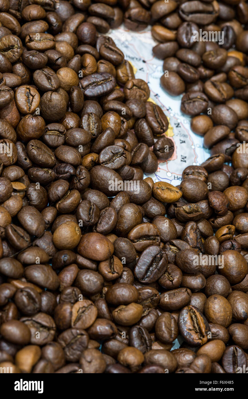 Geographical map of Vietnam covered by a background of roasted coffee ...