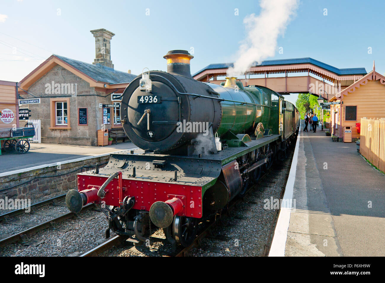 Ex GWR steam loco 4936 'Kinlet Hall' leaves Williton with a train for ...