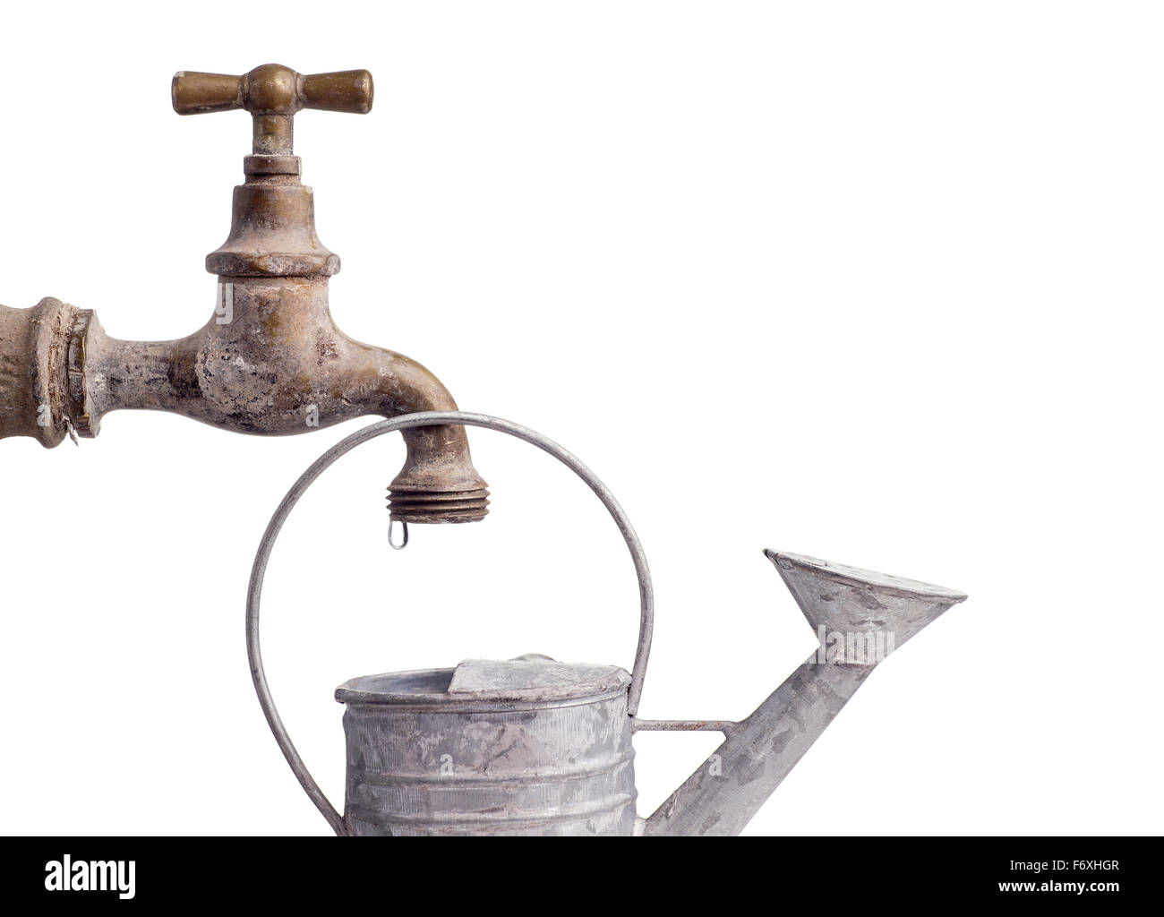 water dripping out of the metal watering can Stock Photo - Alamy