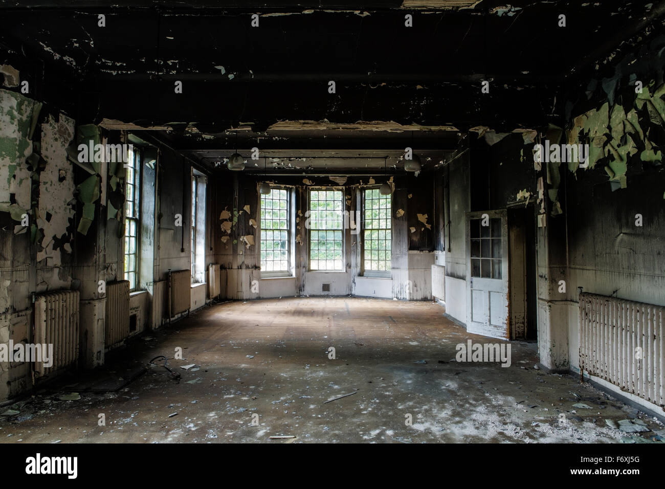 inside view of a deserted run down building after a fire Stock Photo ...