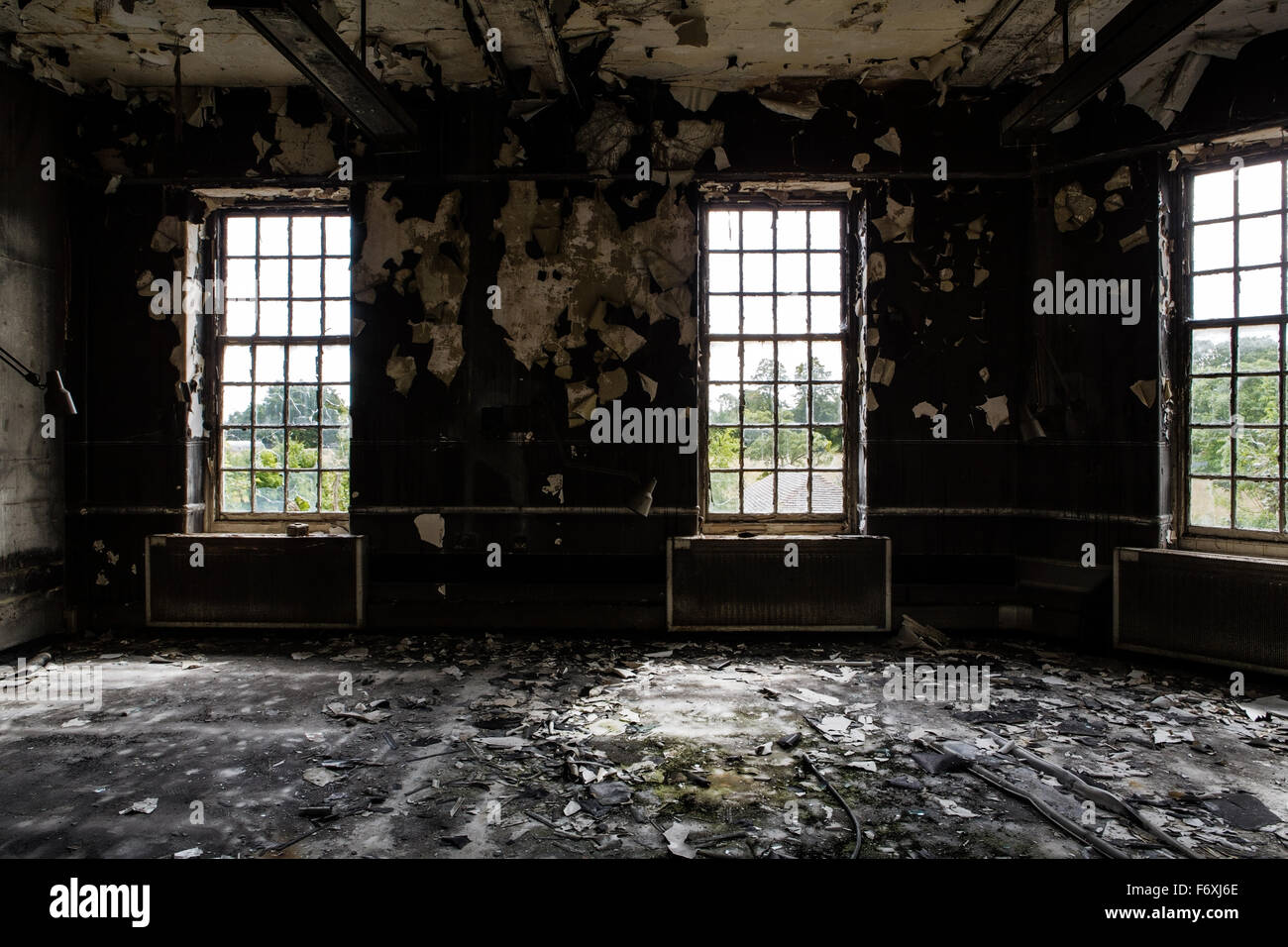inside view of a deserted run down building after a fire Stock Photo ...