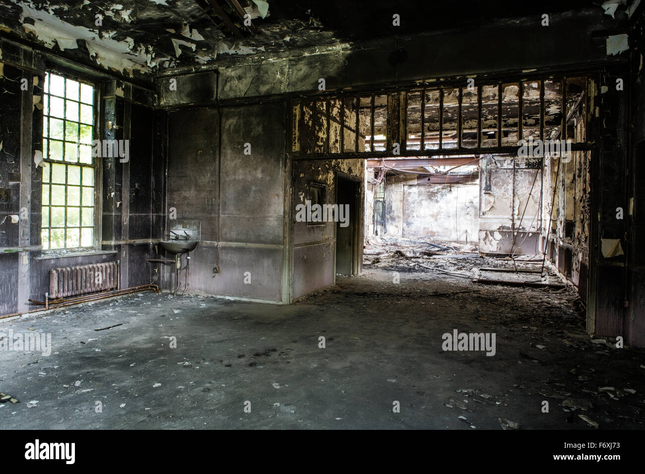 inside view of a deserted run down building after a fire Stock Photo ...