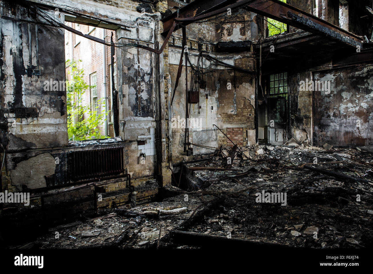 inside view of a deserted run down building after a fire Stock Photo ...