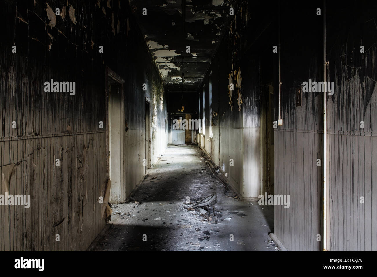 inside view of a deserted run down building after a fire Stock Photo ...