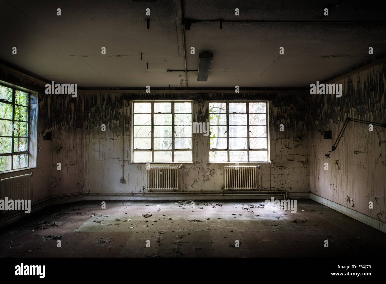 inside view of a deserted run down building Stock Photo - Alamy