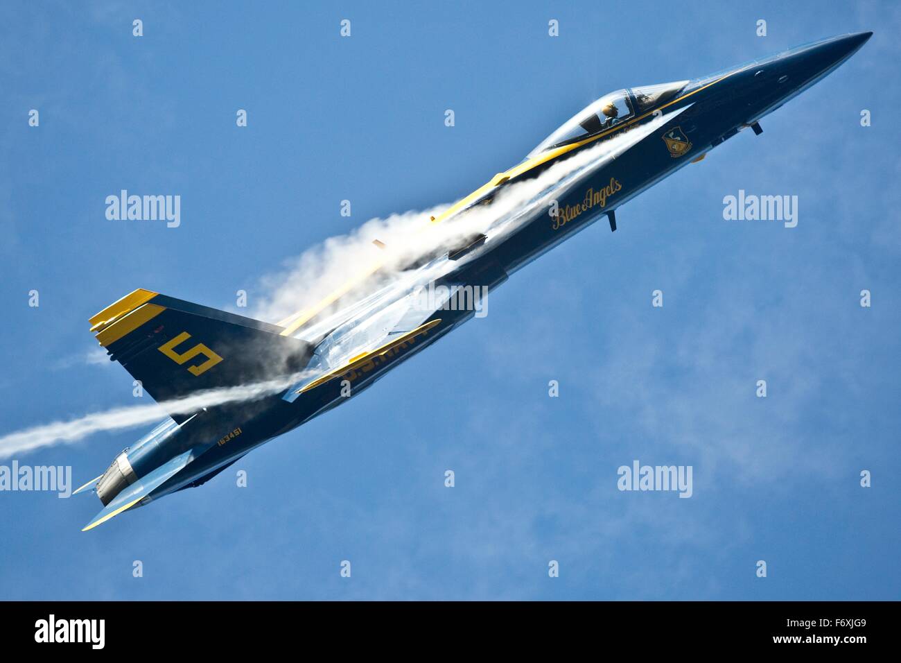 Smoke rolls of the F/A-18 Hornet fighter aircraft of U.S. Navy Lt. Cmdr ...