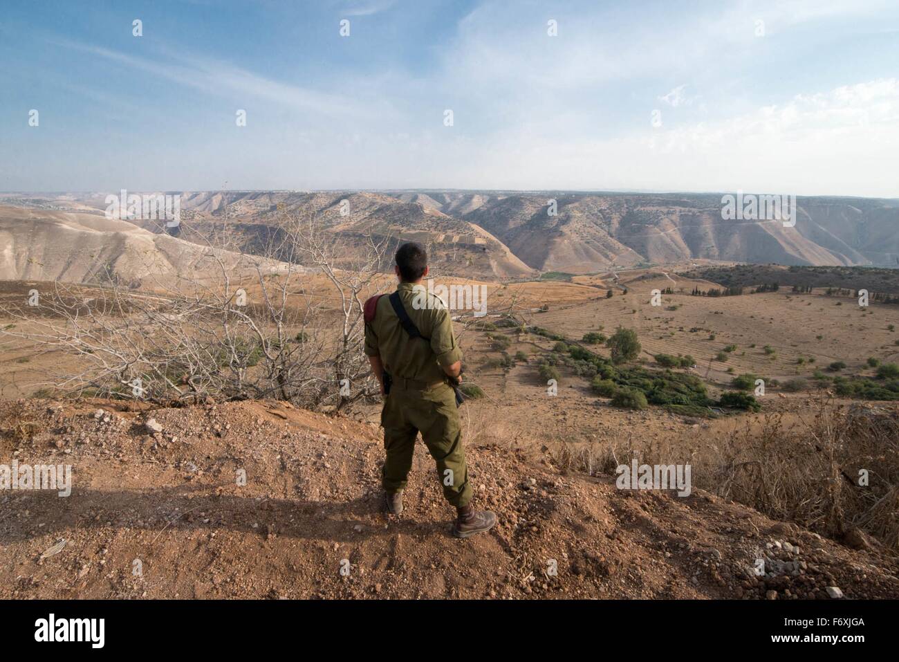 An Israeli soldier looks over the Syrian and Jordan borders October 18 ...