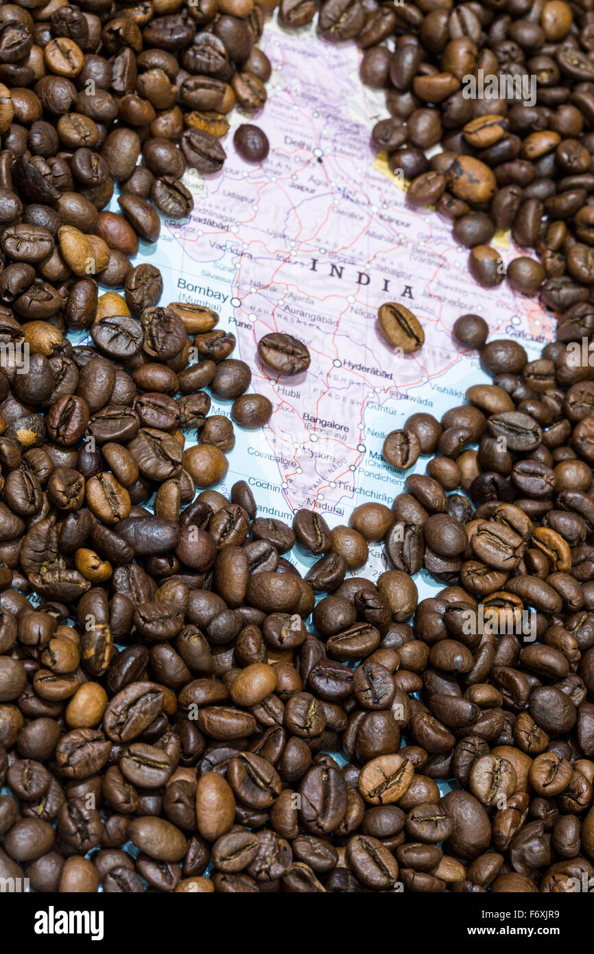 Geographical map of India covered by a background of roasted coffee ...