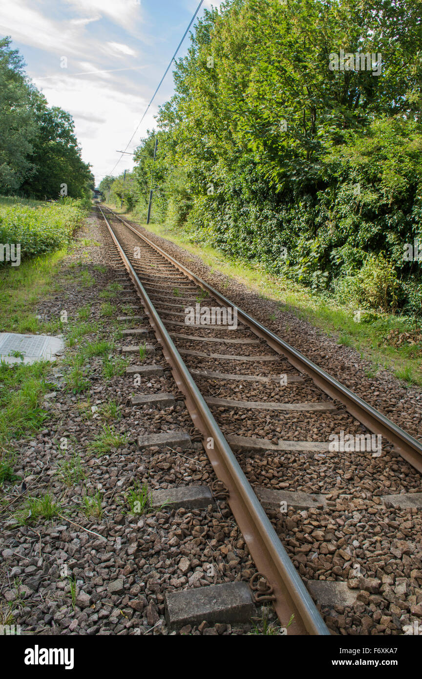 An old railway track surrounded by greenery on a summers day Stock ...