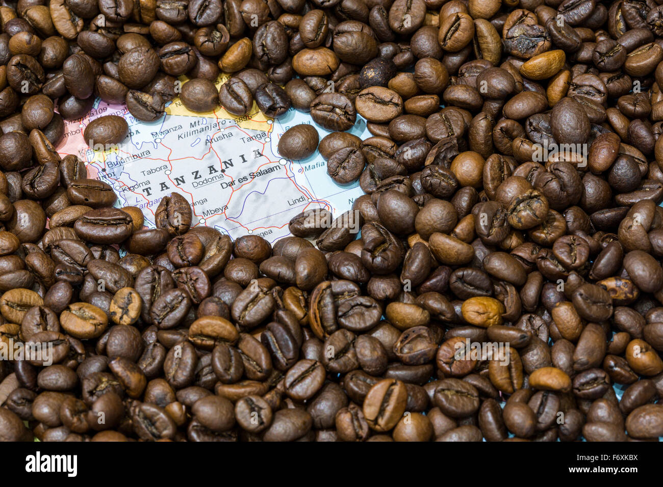 Geographical map of Tanzania covered by a background of roasted coffee ...