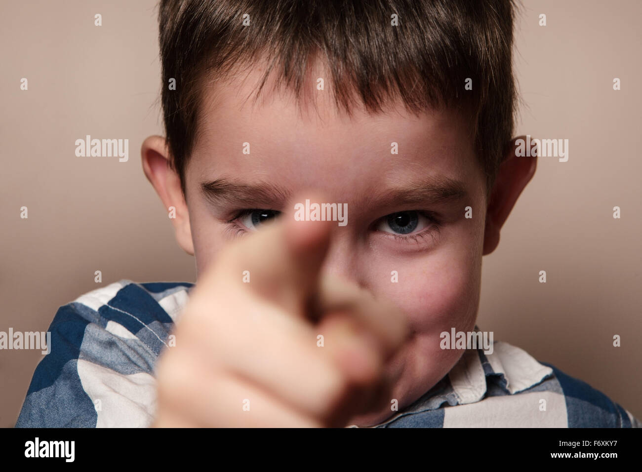 expression of a young boy fooling around infront of camera Stock Photo ...