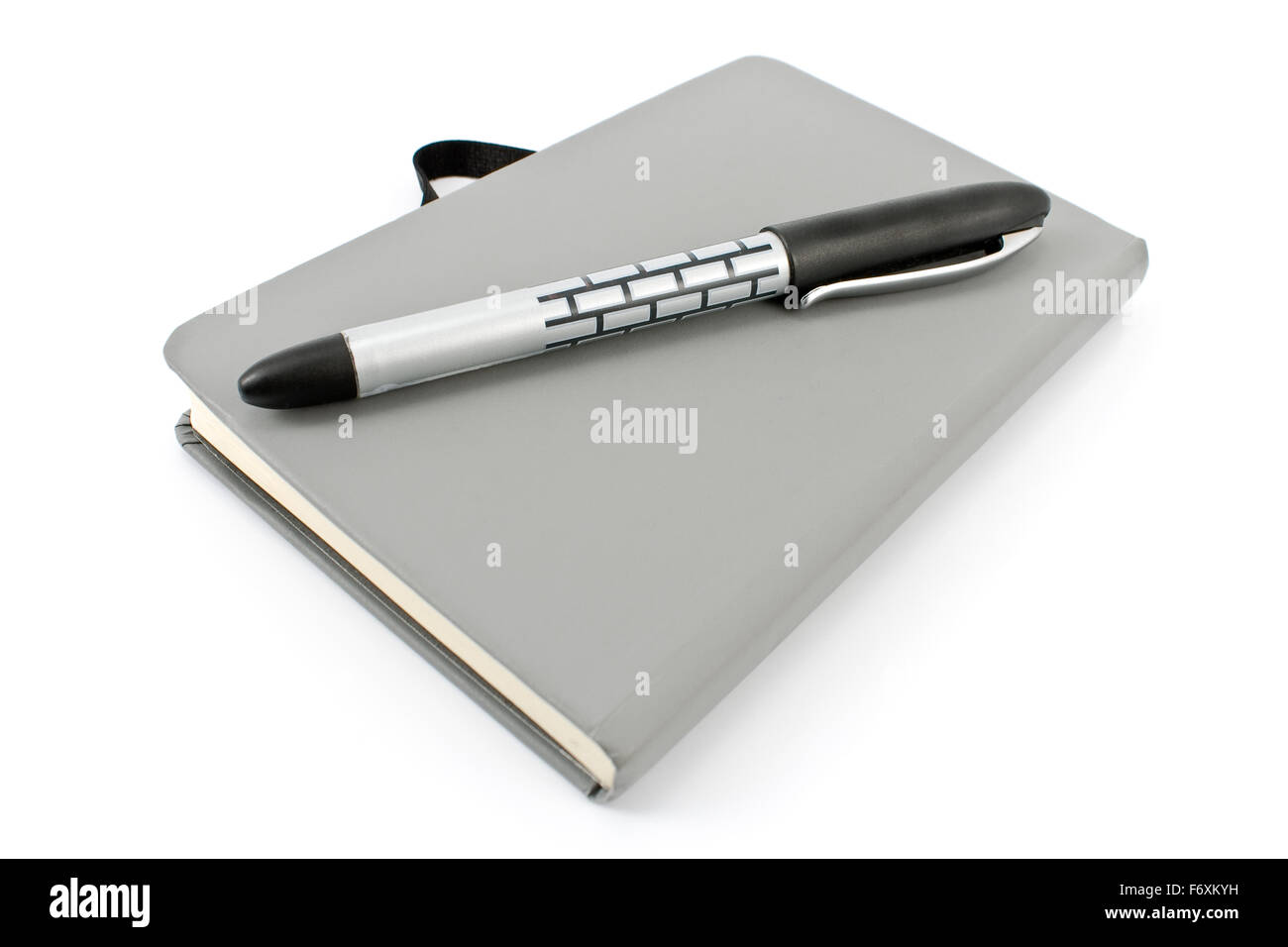 Notepad and pen isolated on white Stock Photo - Alamy