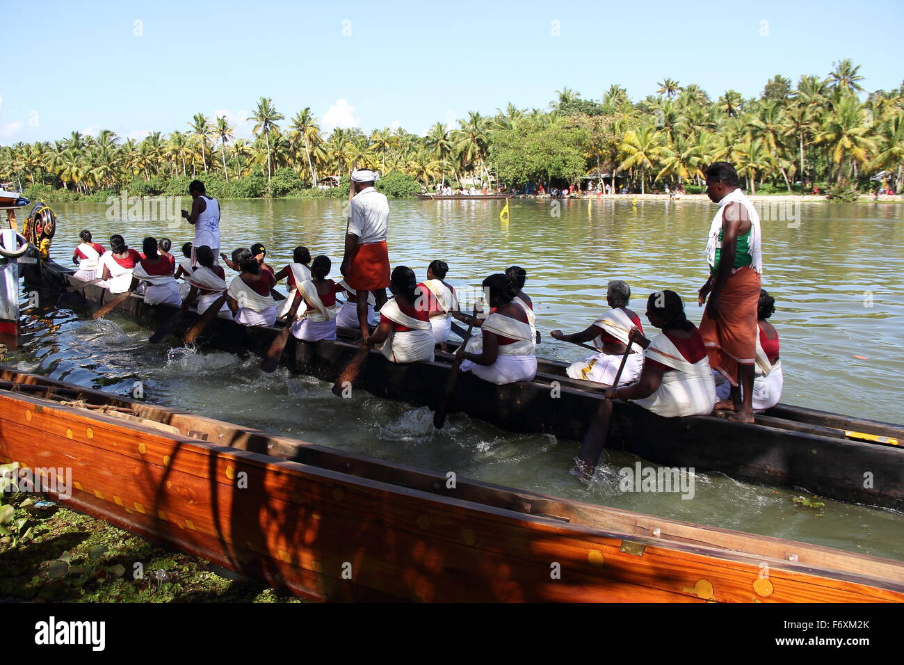 A back view of boat with its lady crew .They are preparing for a boat ...