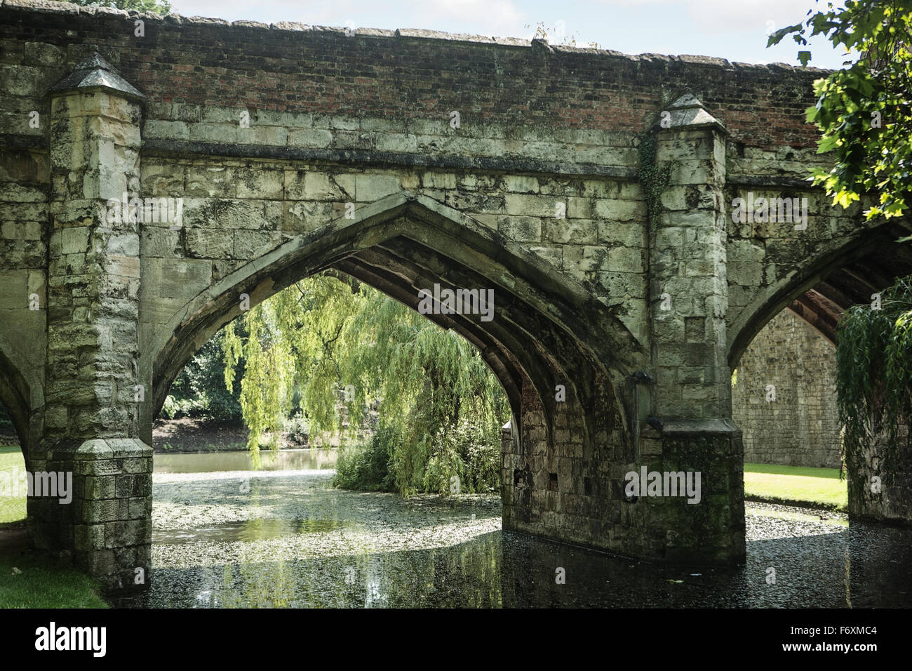 Bridge arch over river on a summers day Stock Photo - Alamy