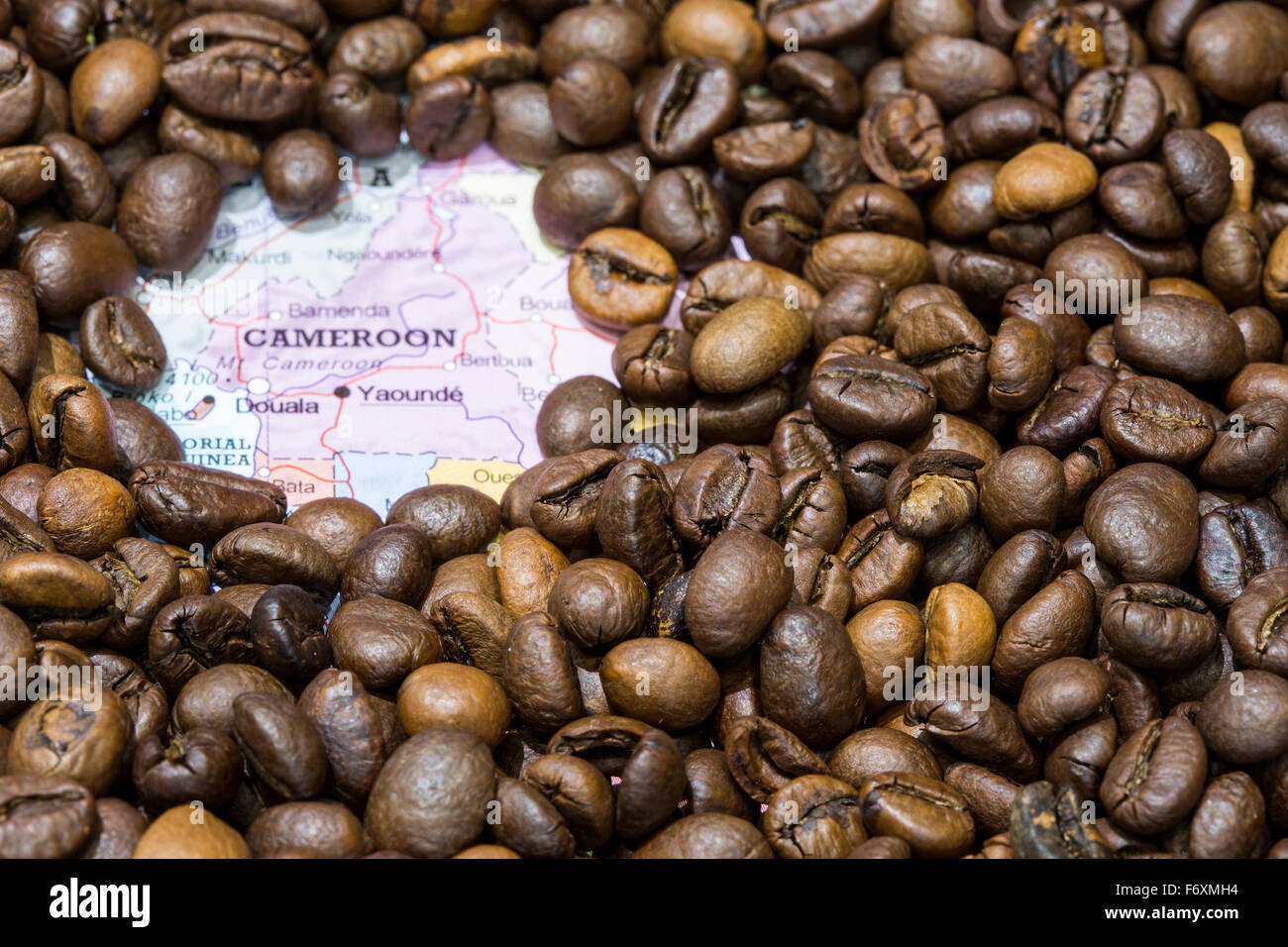 Geographical map of Cameroon covered by a background of roasted coffee ...