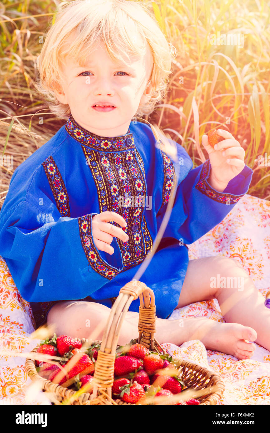 Russian children in traditional Russian costumes playing in the forest ...