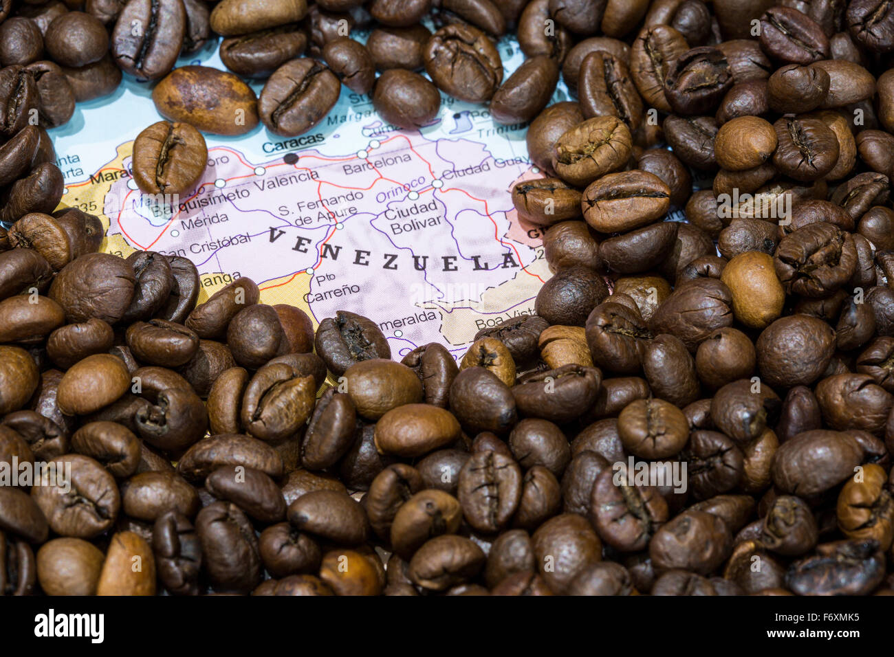 Geographical map of Venezuela covered by a background of roasted coffee ...