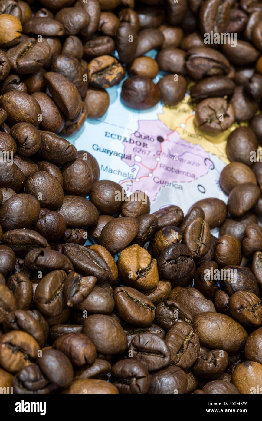 Geographical map of Ecuador covered by a background of roasted coffee ...