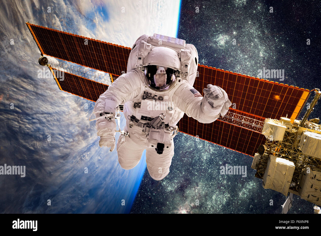 Astronaut in outer space against the backdrop of the planet earth ...