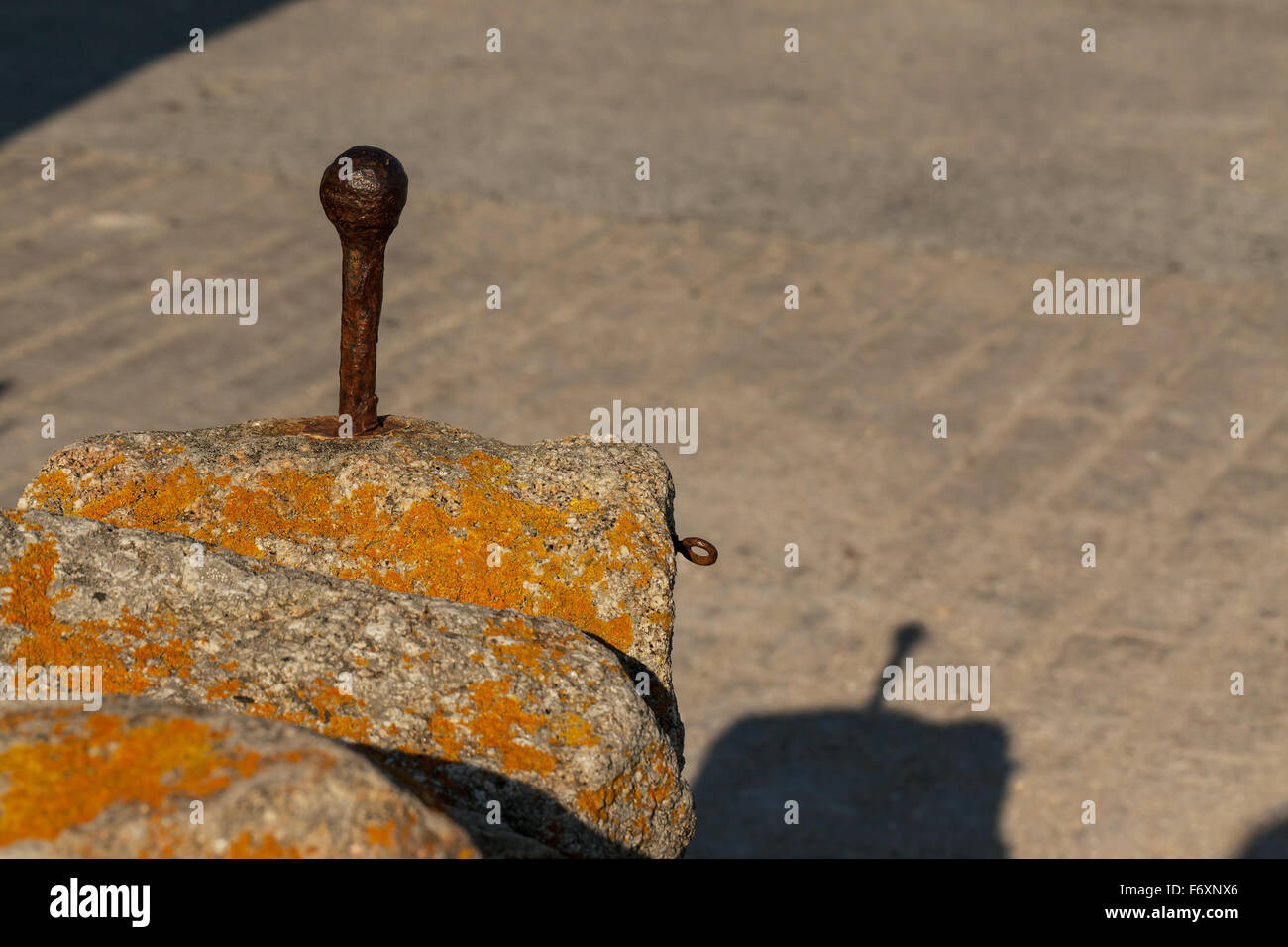 Old metal spike and its shadow Stock Photo - Alamy