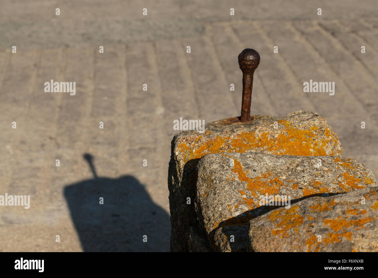 Old metal spike and its shadow Stock Photo - Alamy