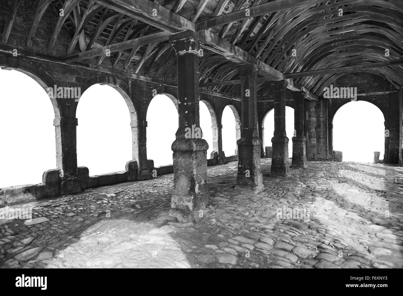 old stone hall with wooden roof and a stone floor Stock Photo - Alamy