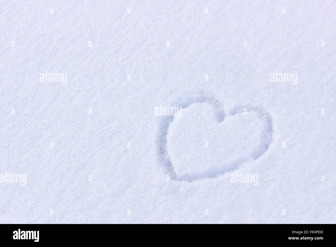 Heart picture on the snow surface Stock Photo - Alamy