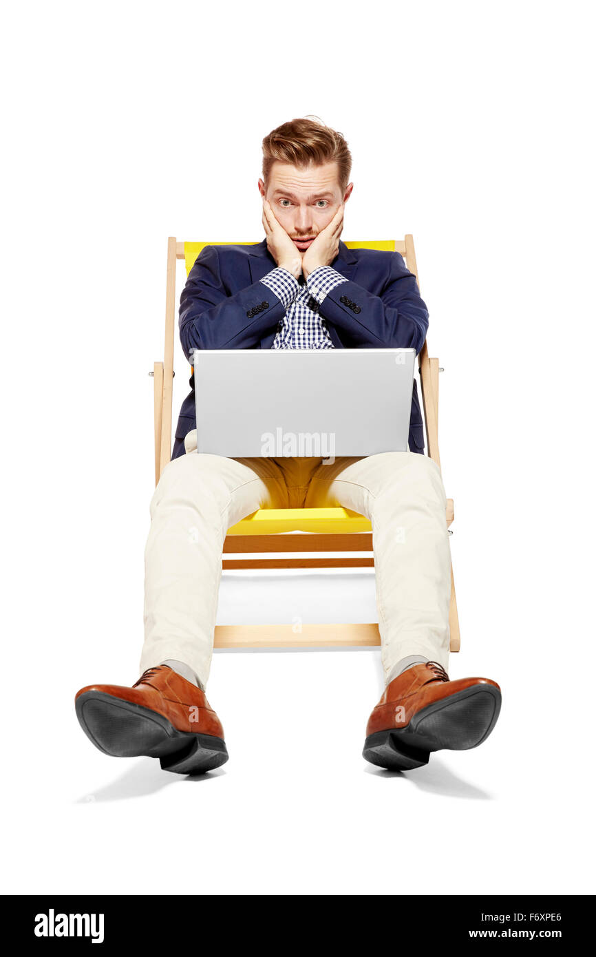 Worry man looking at the computer. Isolated on white Stock Photo - Alamy