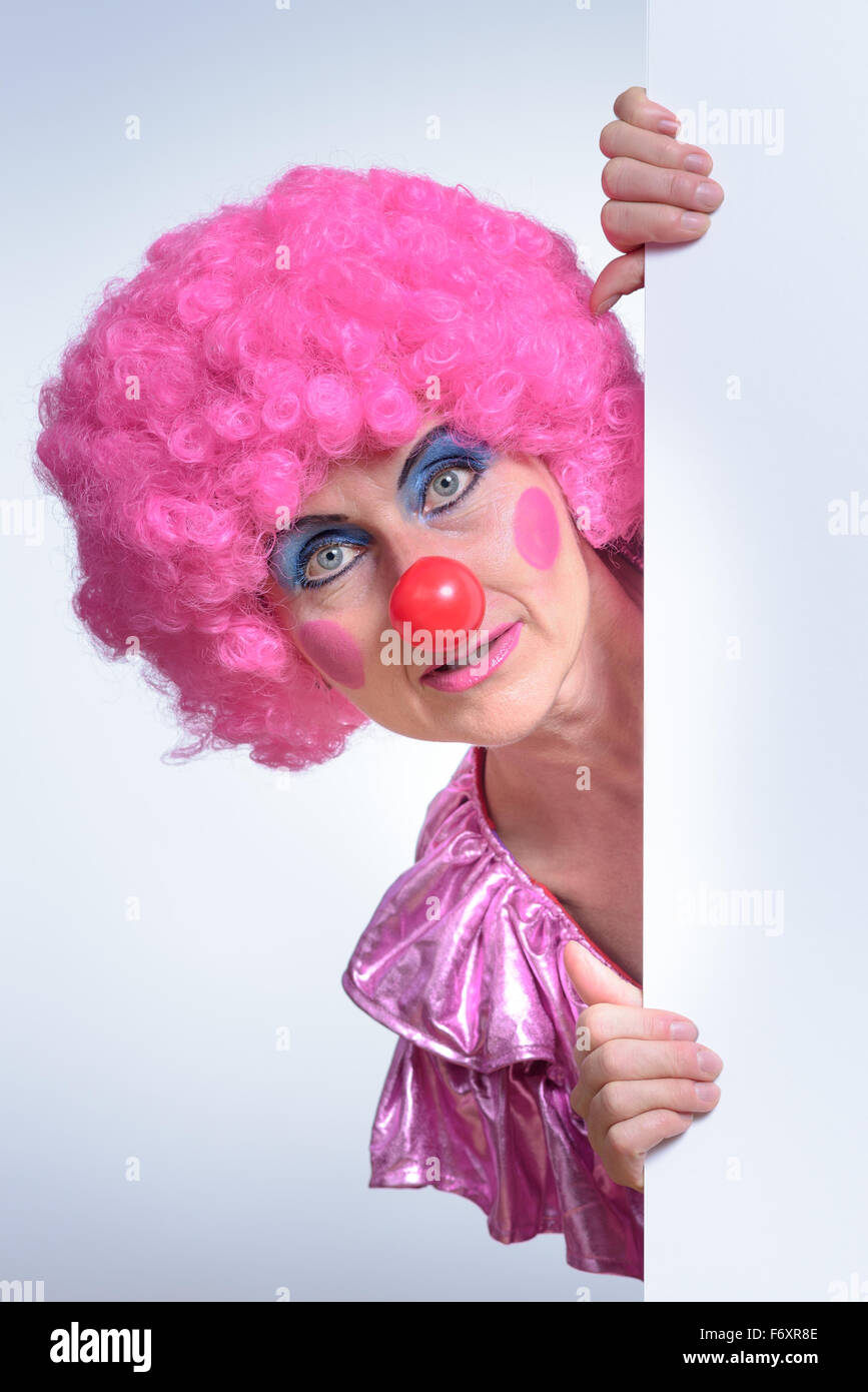 Close up Adult Female Clown with Pink Hair, Peeking Out From Behind ...
