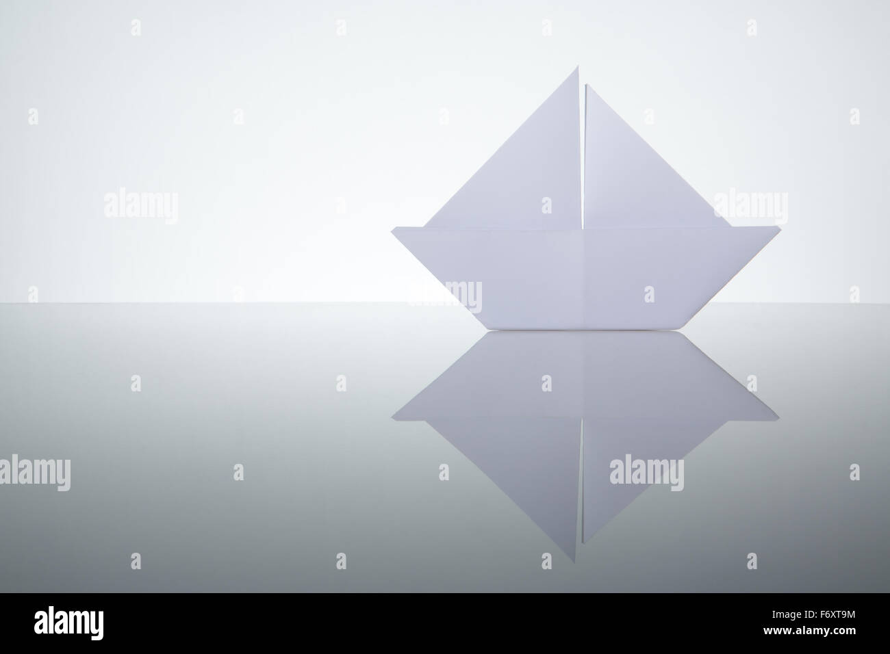 Still life image of a origami boat make from plain paper Stock Photo ...