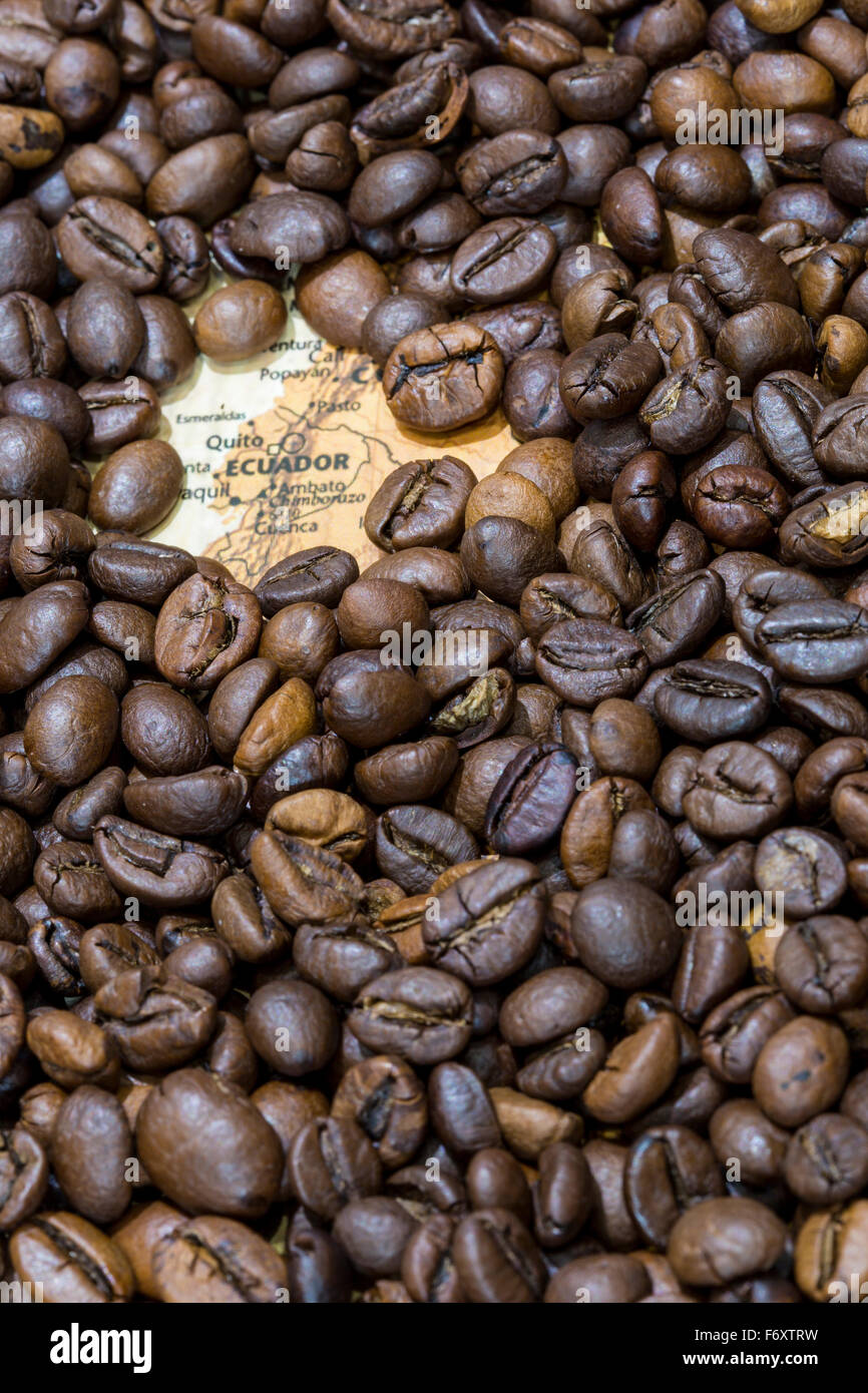 Vintage map of Ecuador covered by a background of roasted coffee beans ...