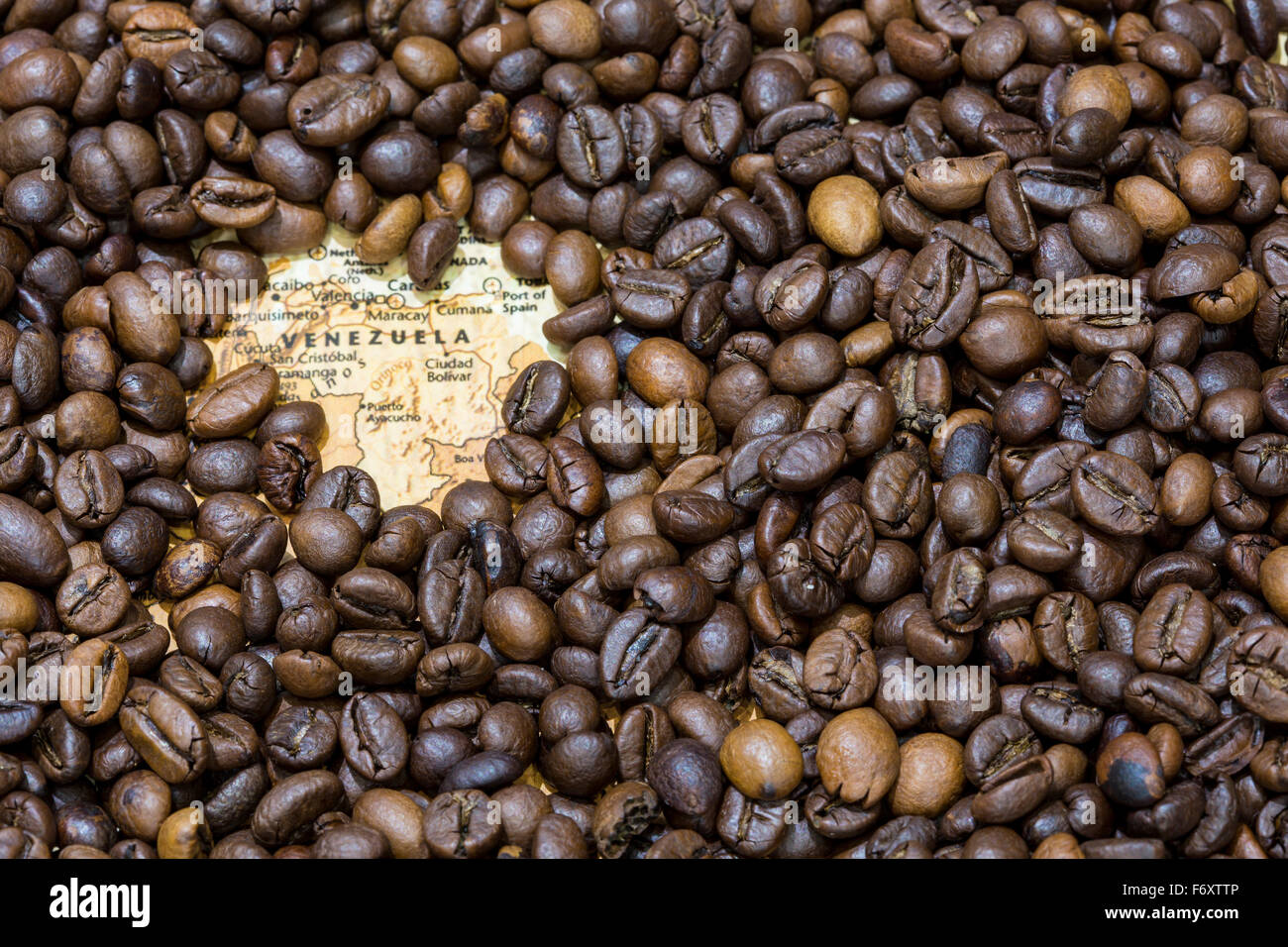 Vintage map of Venezuela covered by a background of roasted coffee ...