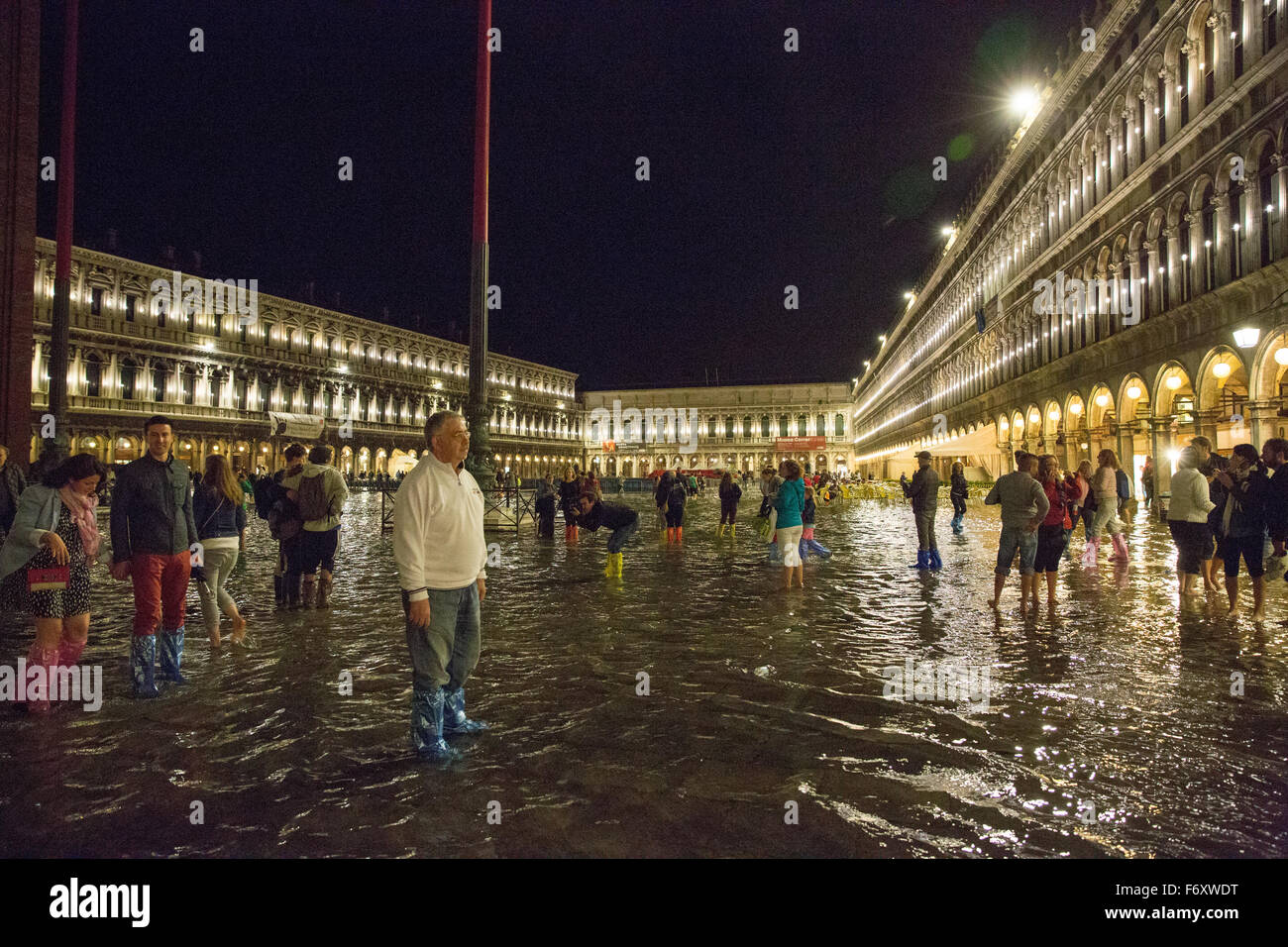 Flooding in St Mark's Square, Venice, Italy. People wade through the ...